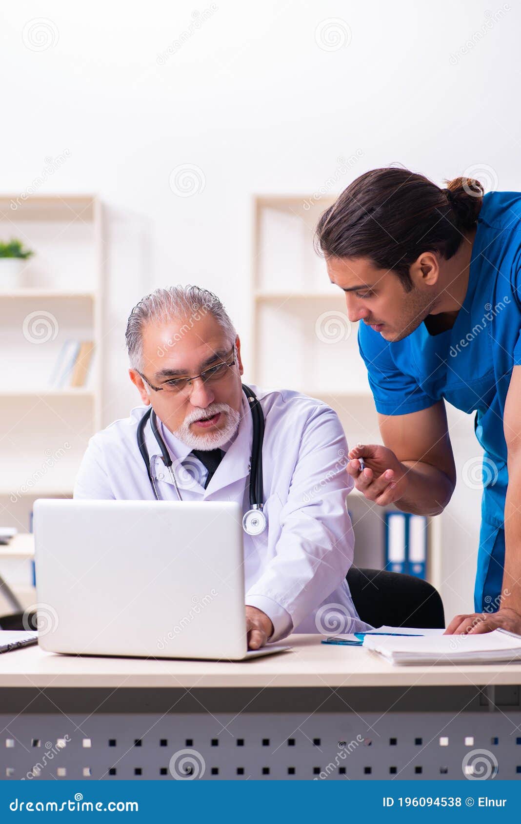 Two Male Doctors Working in the Clinic Stock Photo - Image of ...