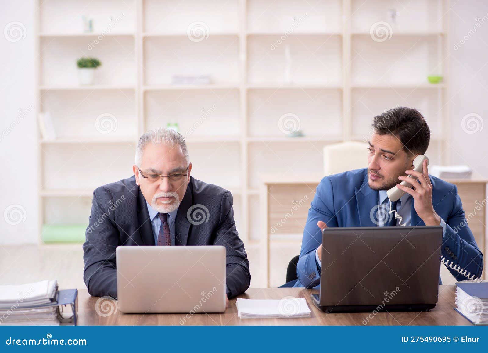 Two Male Employees Working in the Office Stock Image - Image of ...