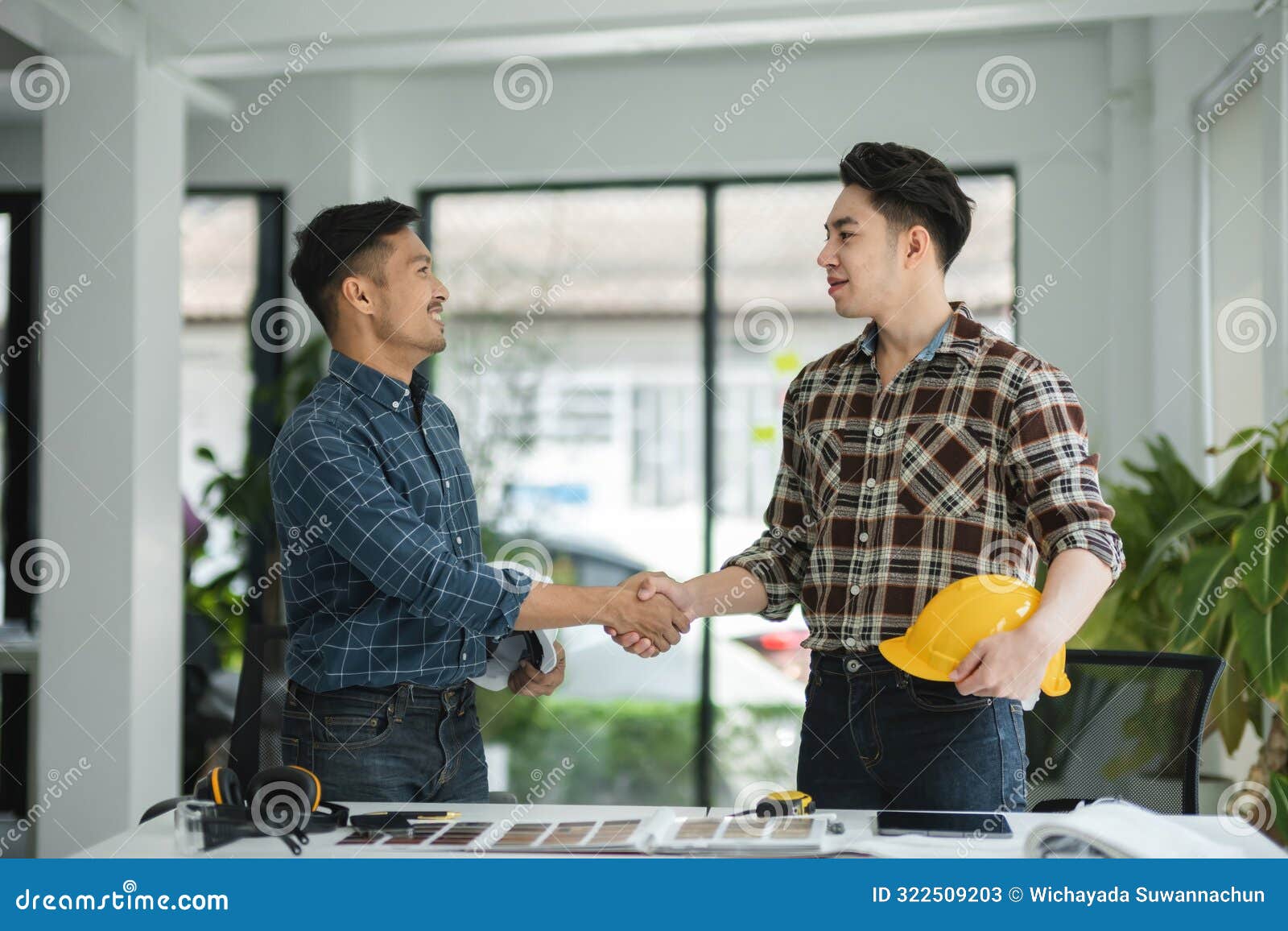 Two Male Engineers Shaking Hands in a Modern Office Environment ...