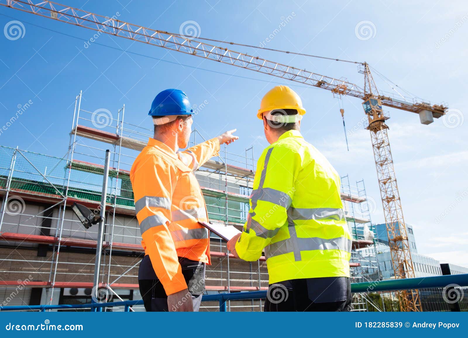Two Male Engineers Supervising the Construction Site Stock Image ...
