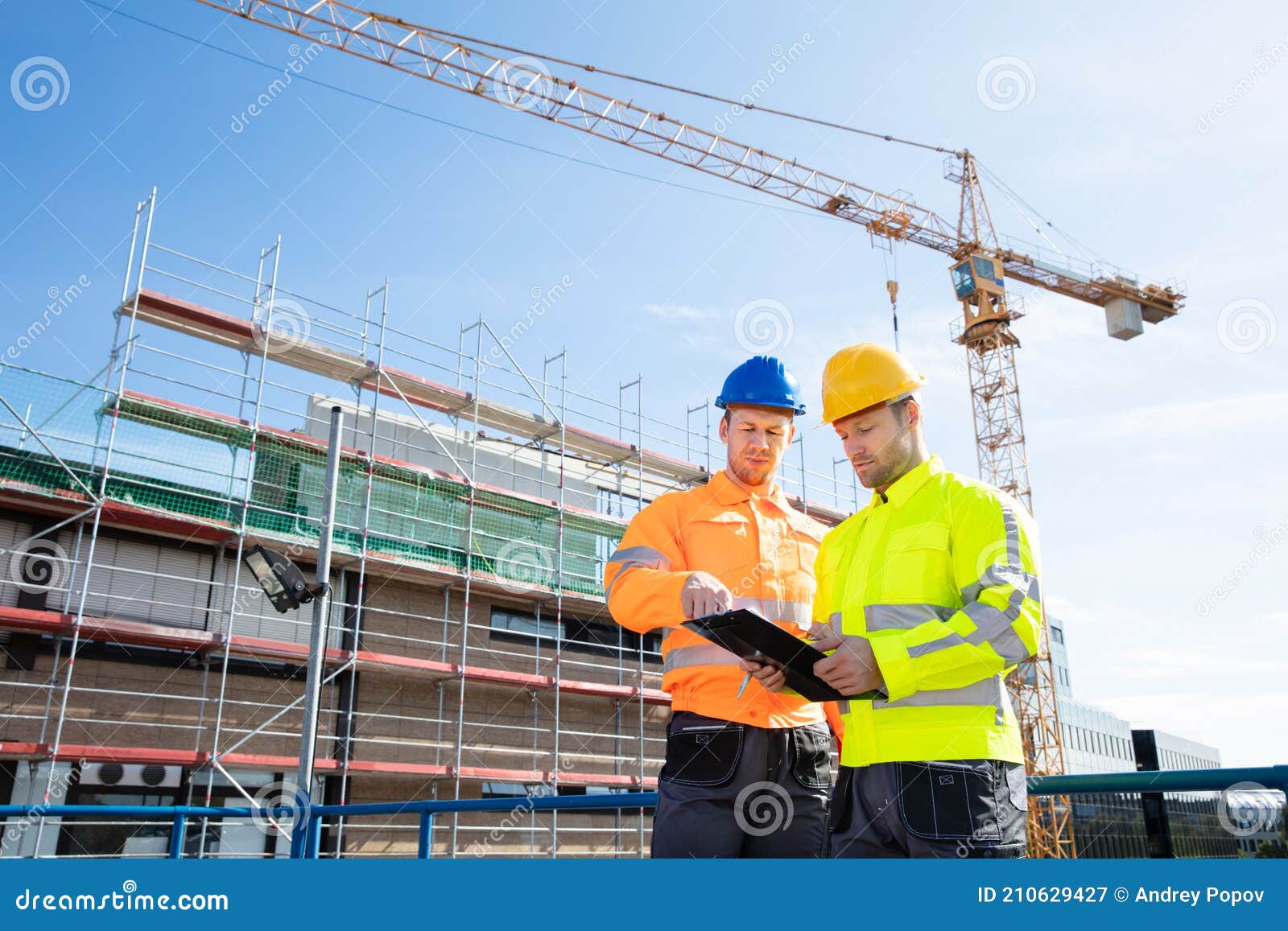 Two Male Engineers Supervising the Construction Site Stock Image ...