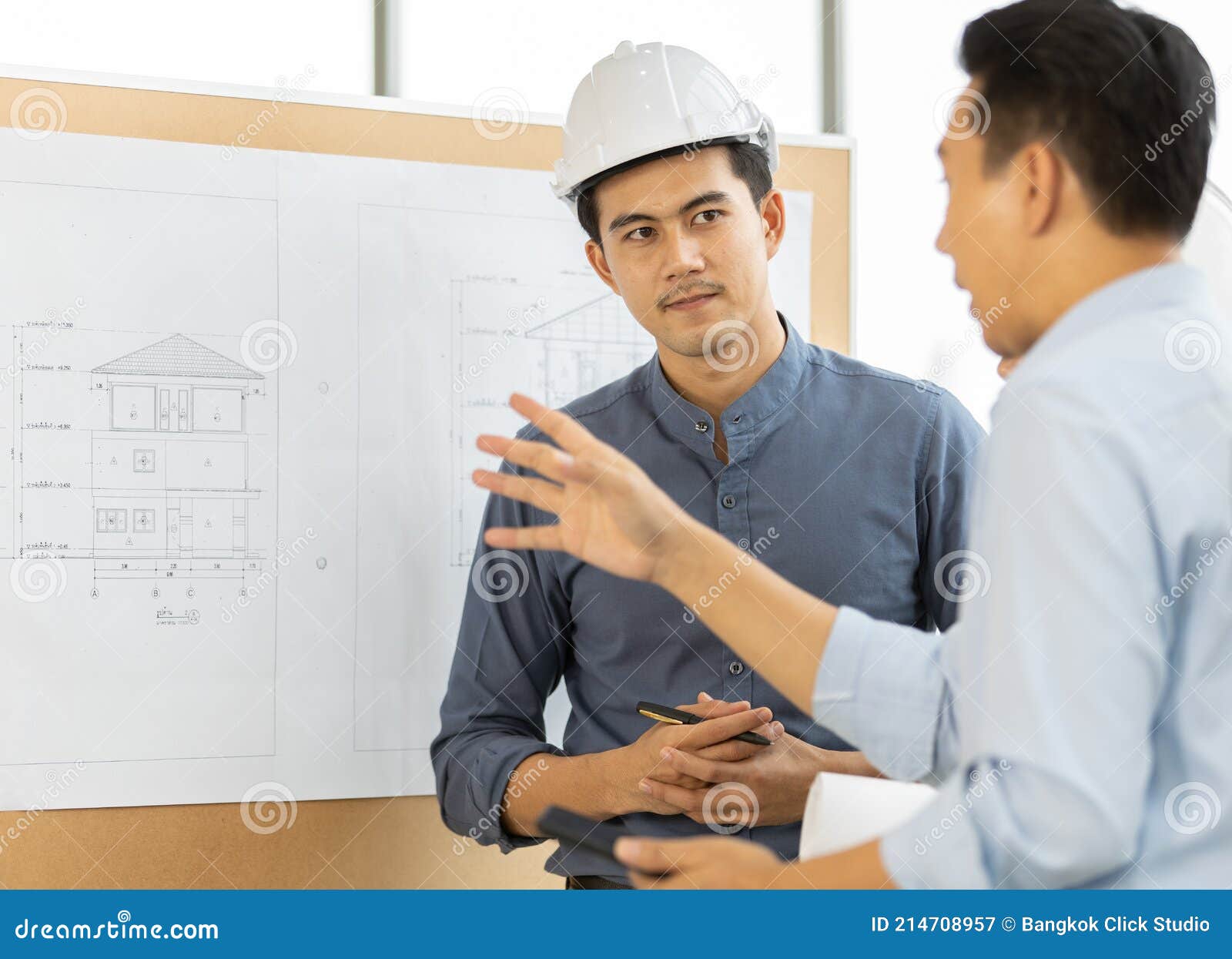 Two Male Engineers Team Talking and Discussing a Home Plan for a ...