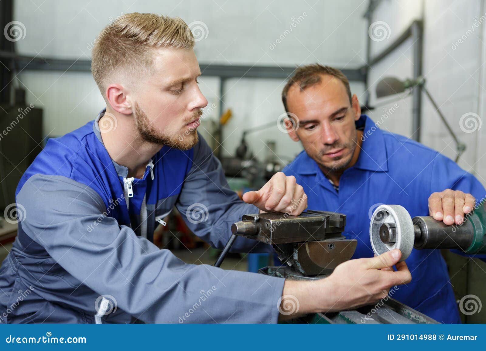 Two Male Engineers Working Together on Machinery Stock Photo - Image of ... Two Male Engineers Working Together on Machinery Stock Photo - Image of ...