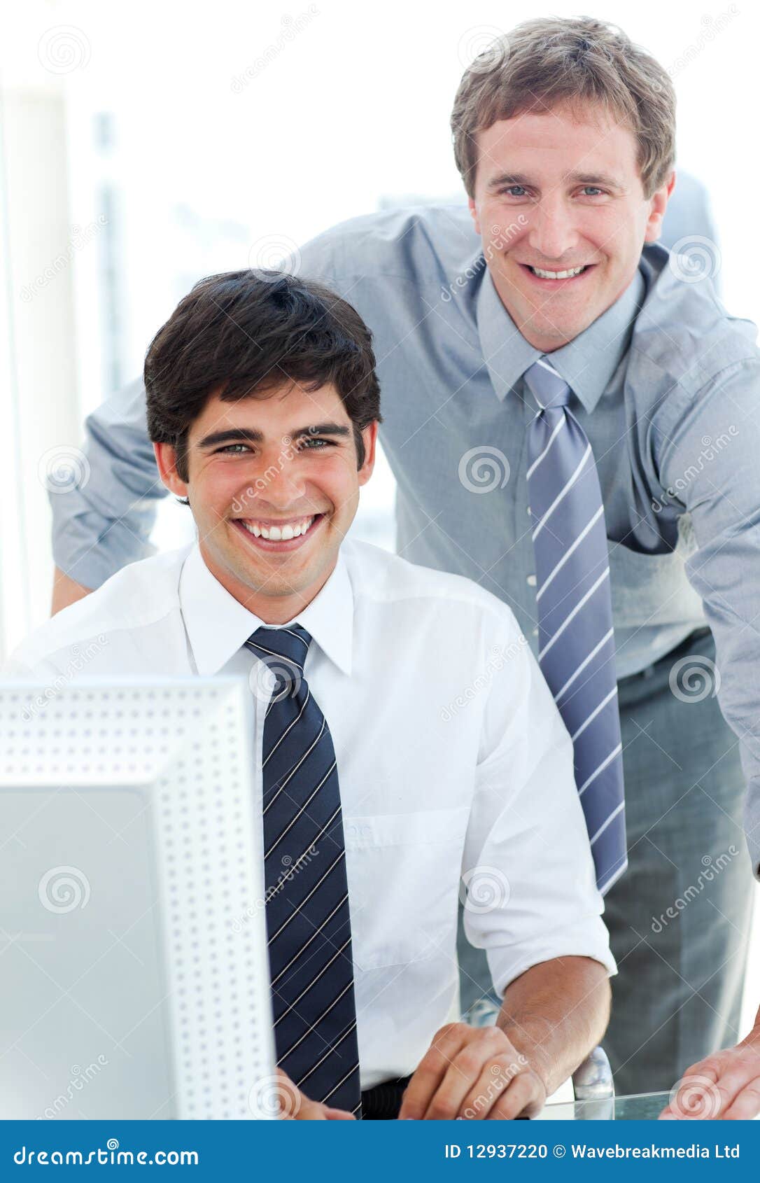 Two Male Executives Working at a Computer Stock Photo - Image of ...