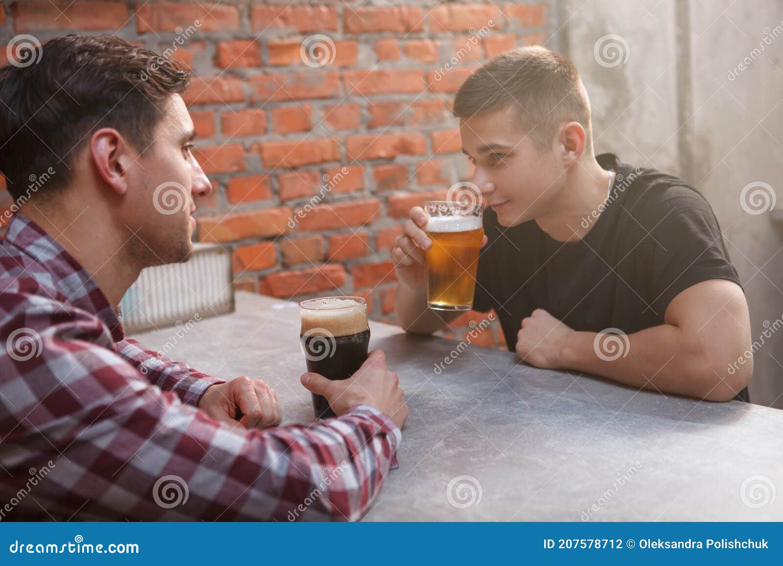 Two Male Friends Drinking Beer Together Stock Photo - Image of ...