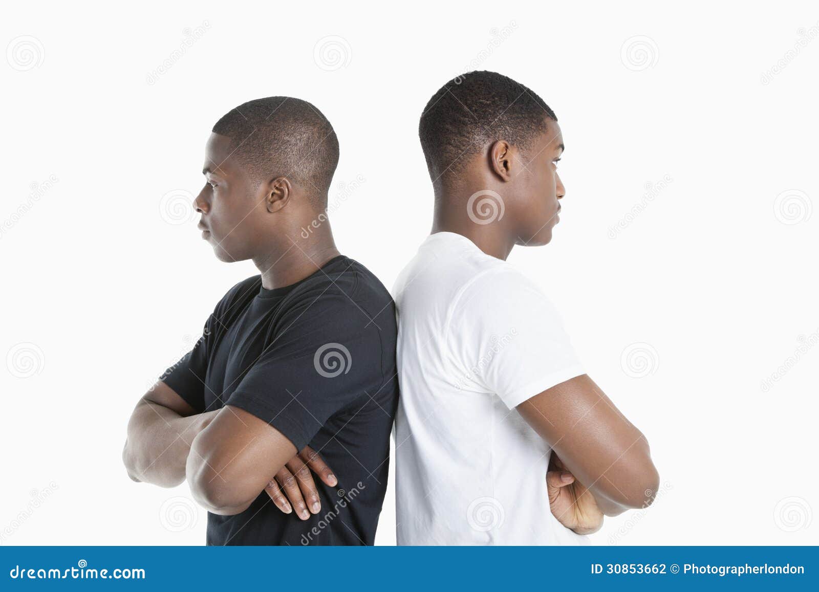 Two Men Standing Back To Back