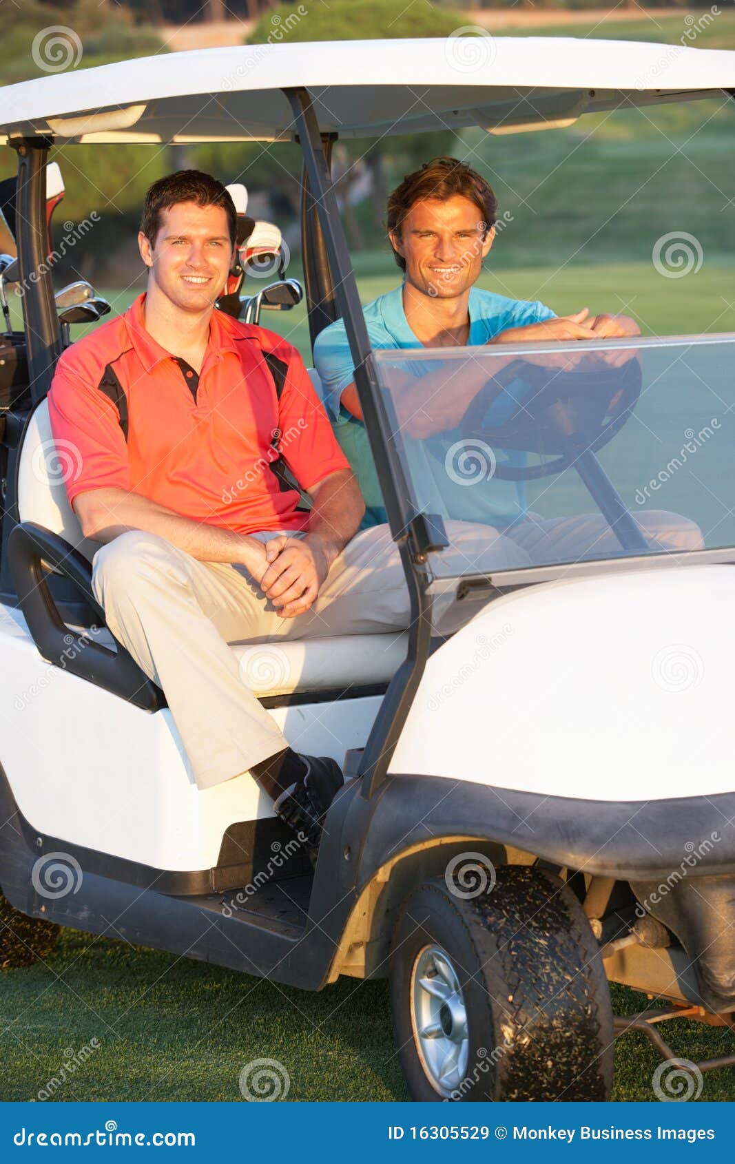 Two Male Golfers Riding in Golf Buggy Stock Image - Image of group ...
