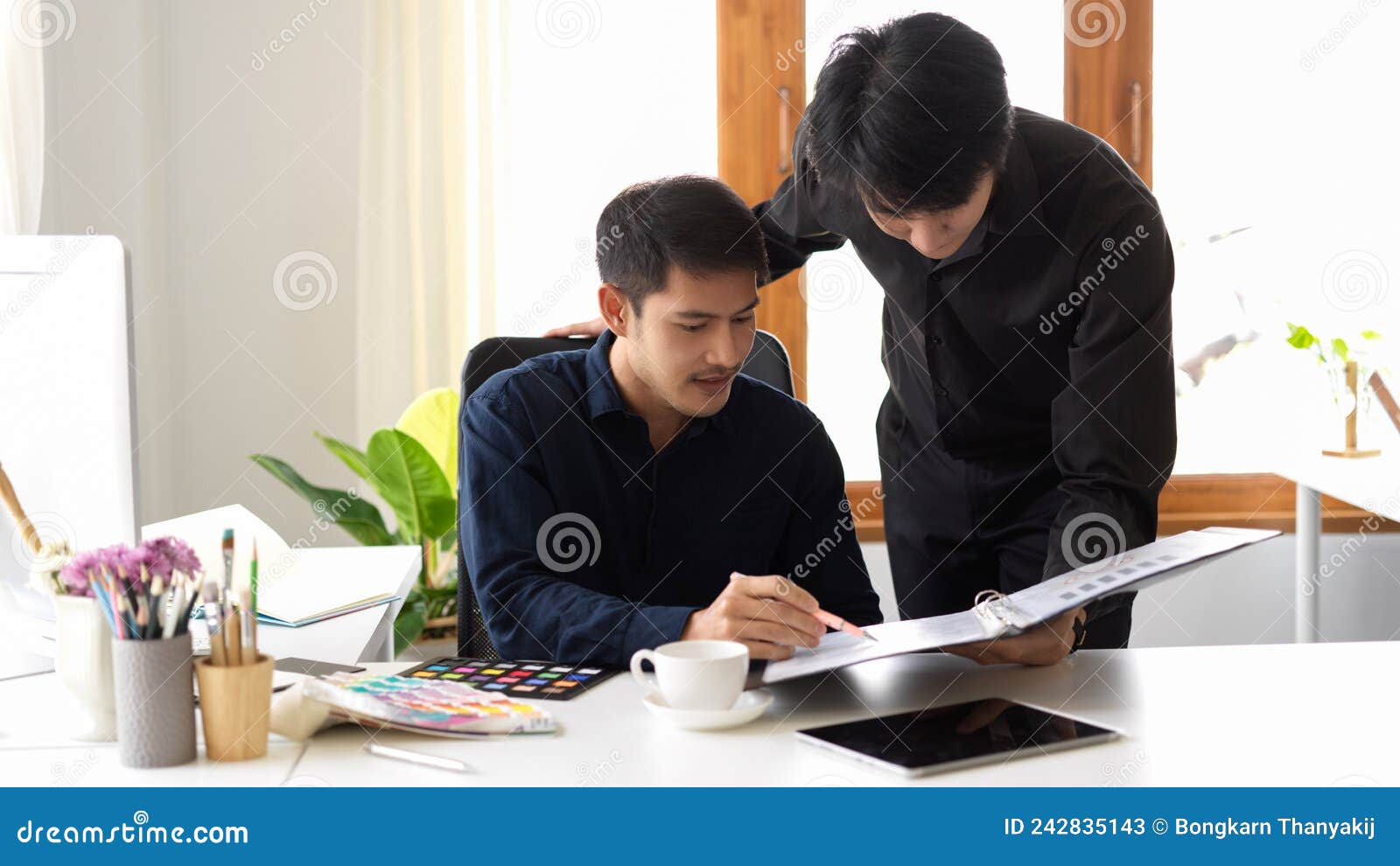 Two Male Graphic Designers Discussing Idea and Working Together Stock ...