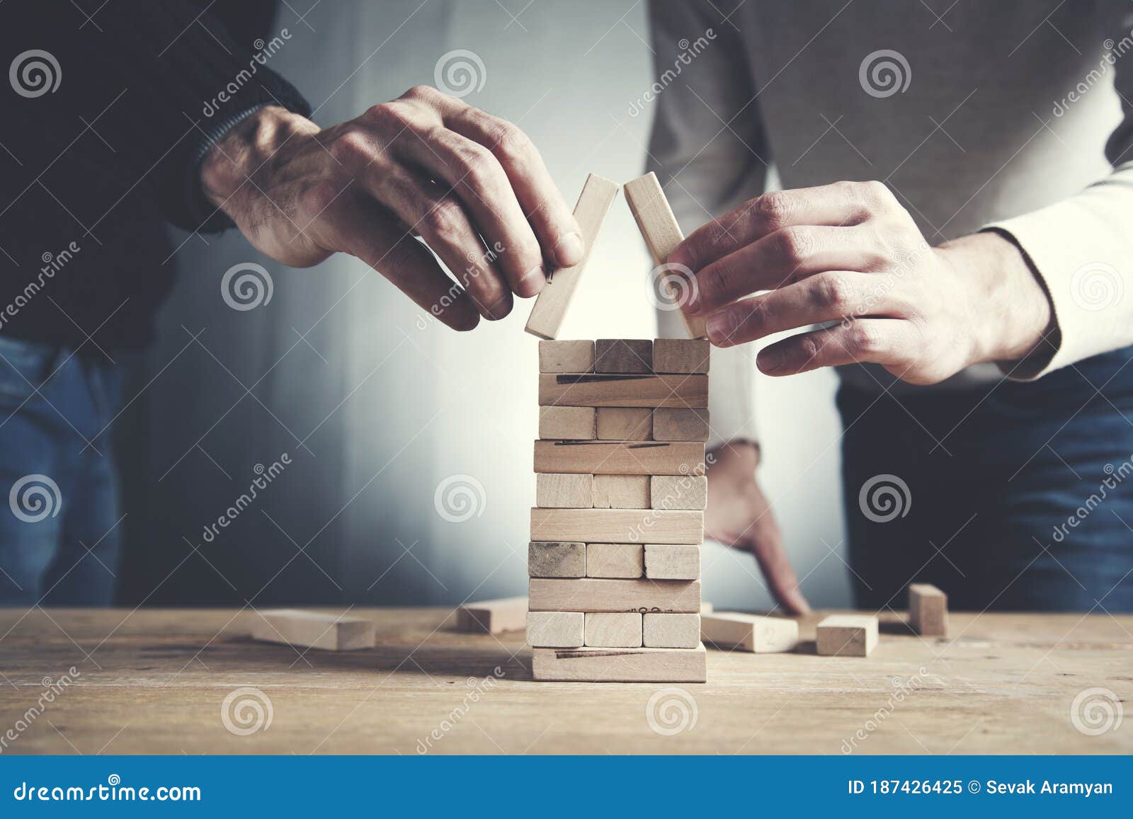 Two Male Hands Building a Structure of Wooden Blocks Stock Image ...