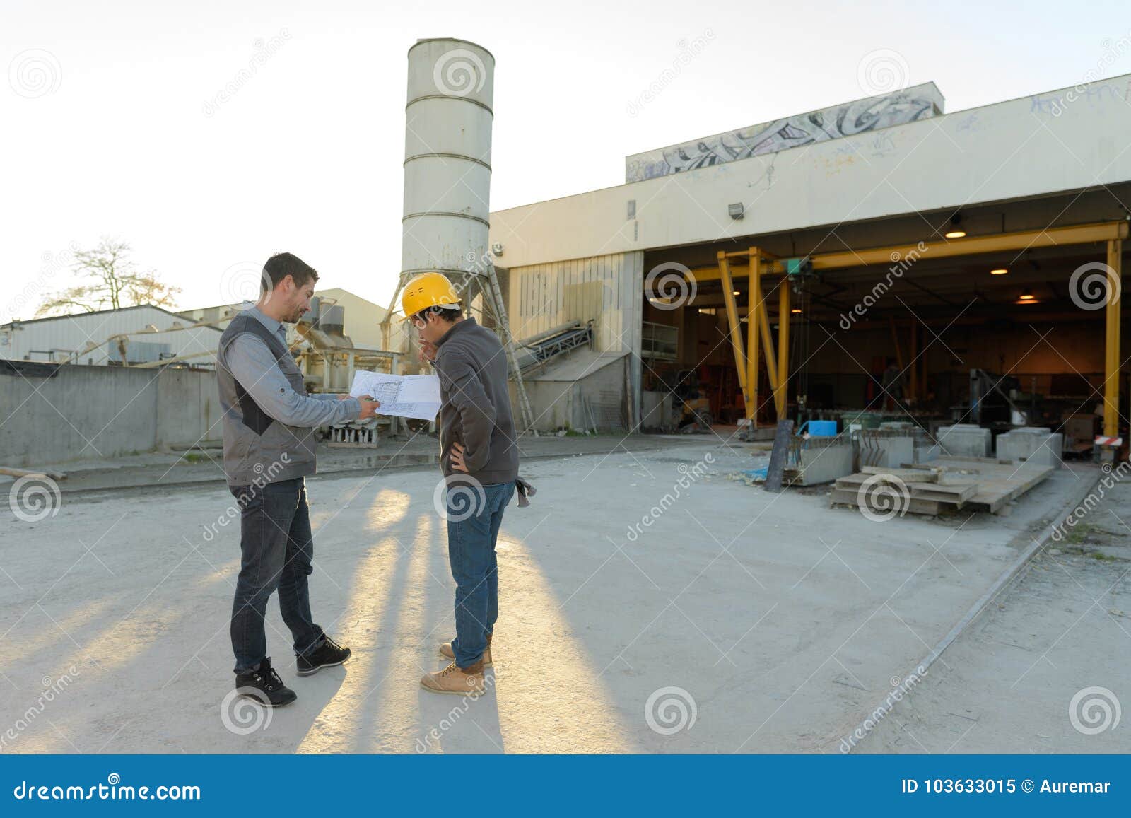 Two Male Hardware Store Workers Working in Yard Stock Image - Image of ...