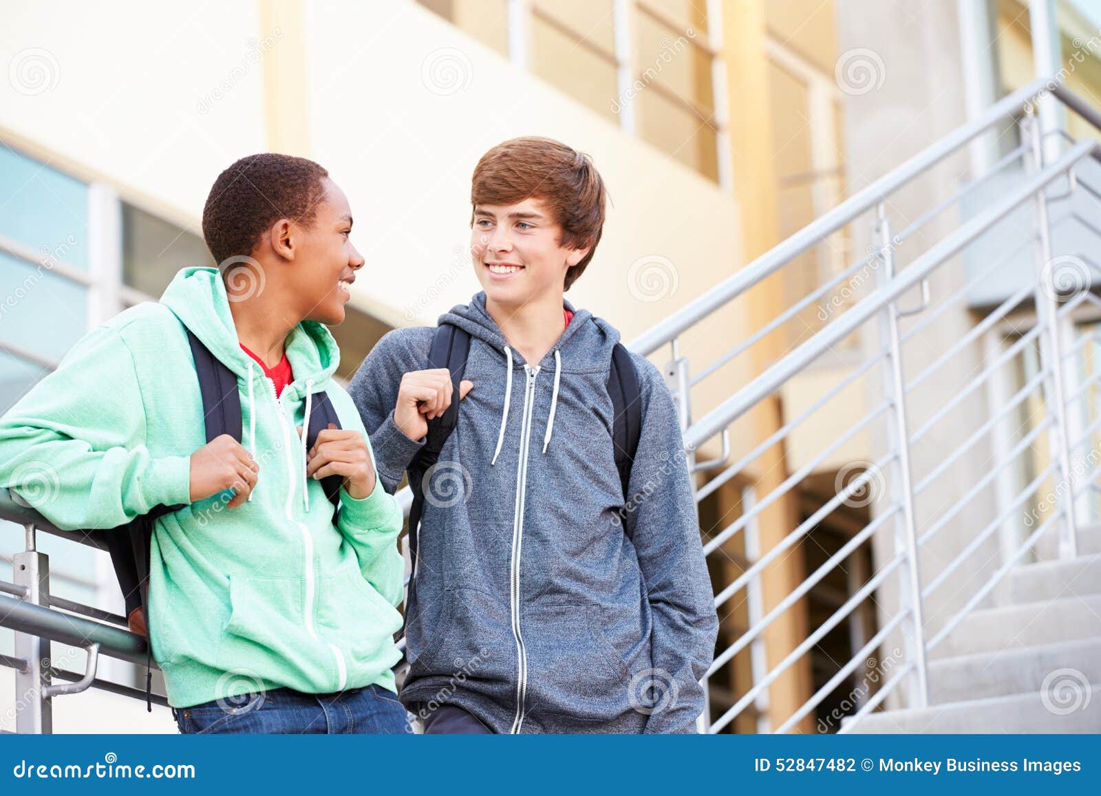 Two Male High School Students Standing Outside Building Stock Photo ...