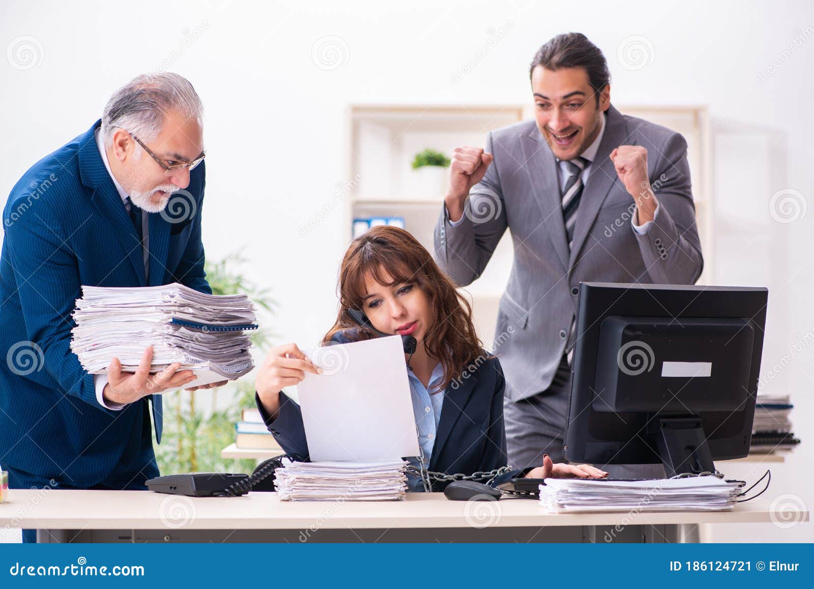 Two Male and One Female Employees Working in the Office Stock Image ...