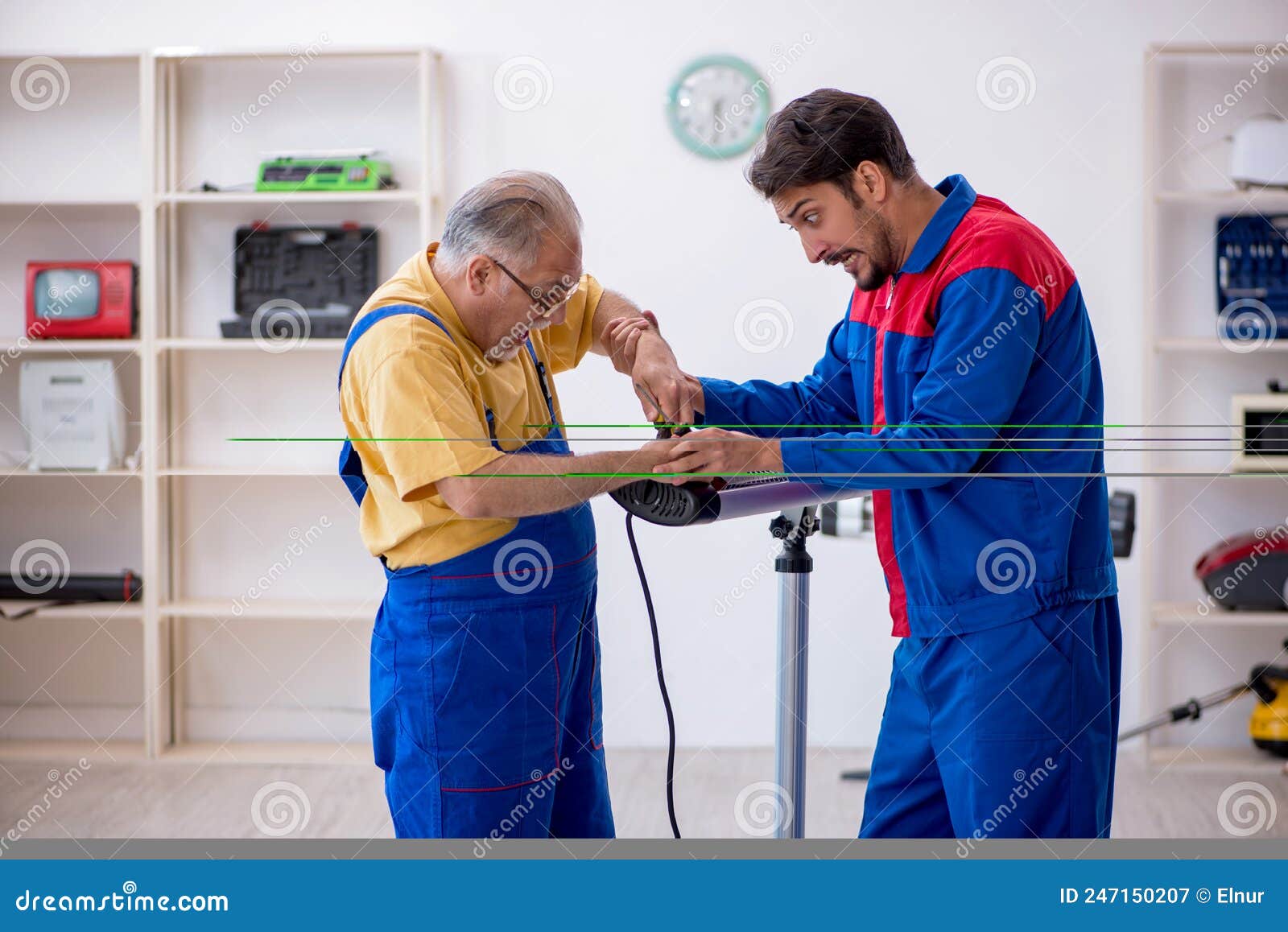 Two Male Repairmen Working at Workshop Stock Image - Image of ...