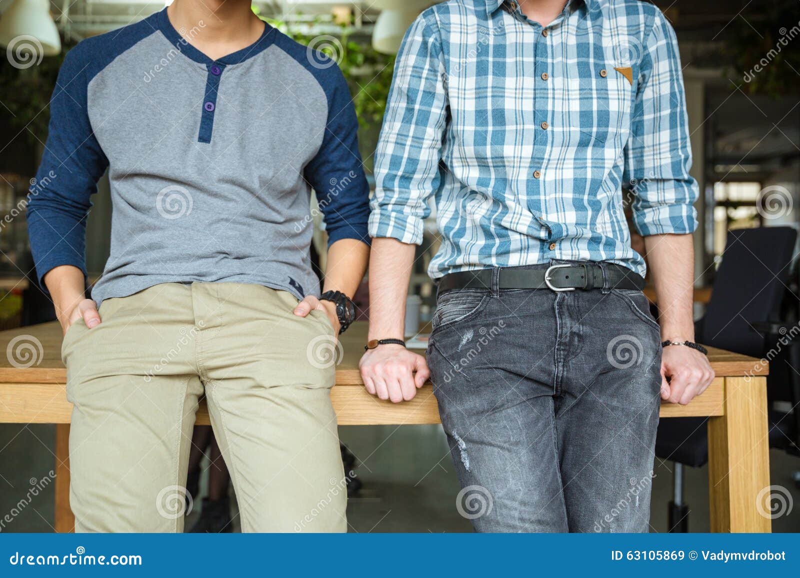 Two Male Standing Leaning on the Wooden Table Stock Image - Image of ...