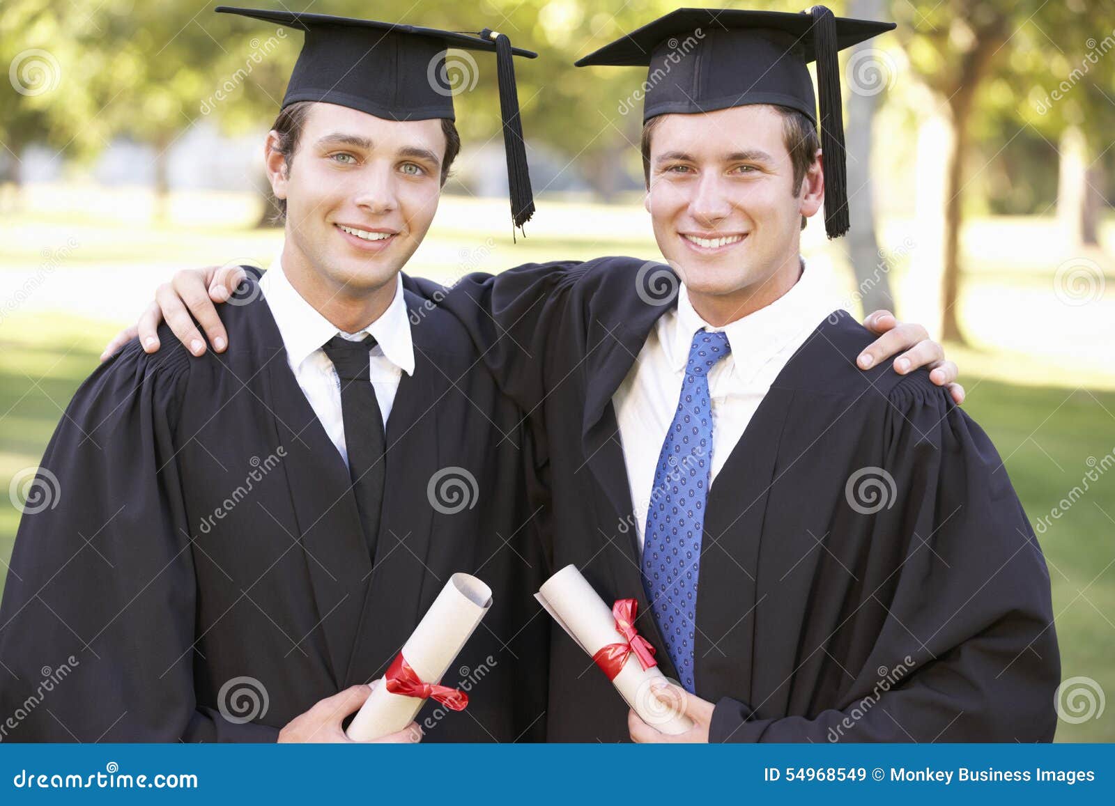 Two Male Students Attending Graduation Ceremony Stock Image - Image of ...