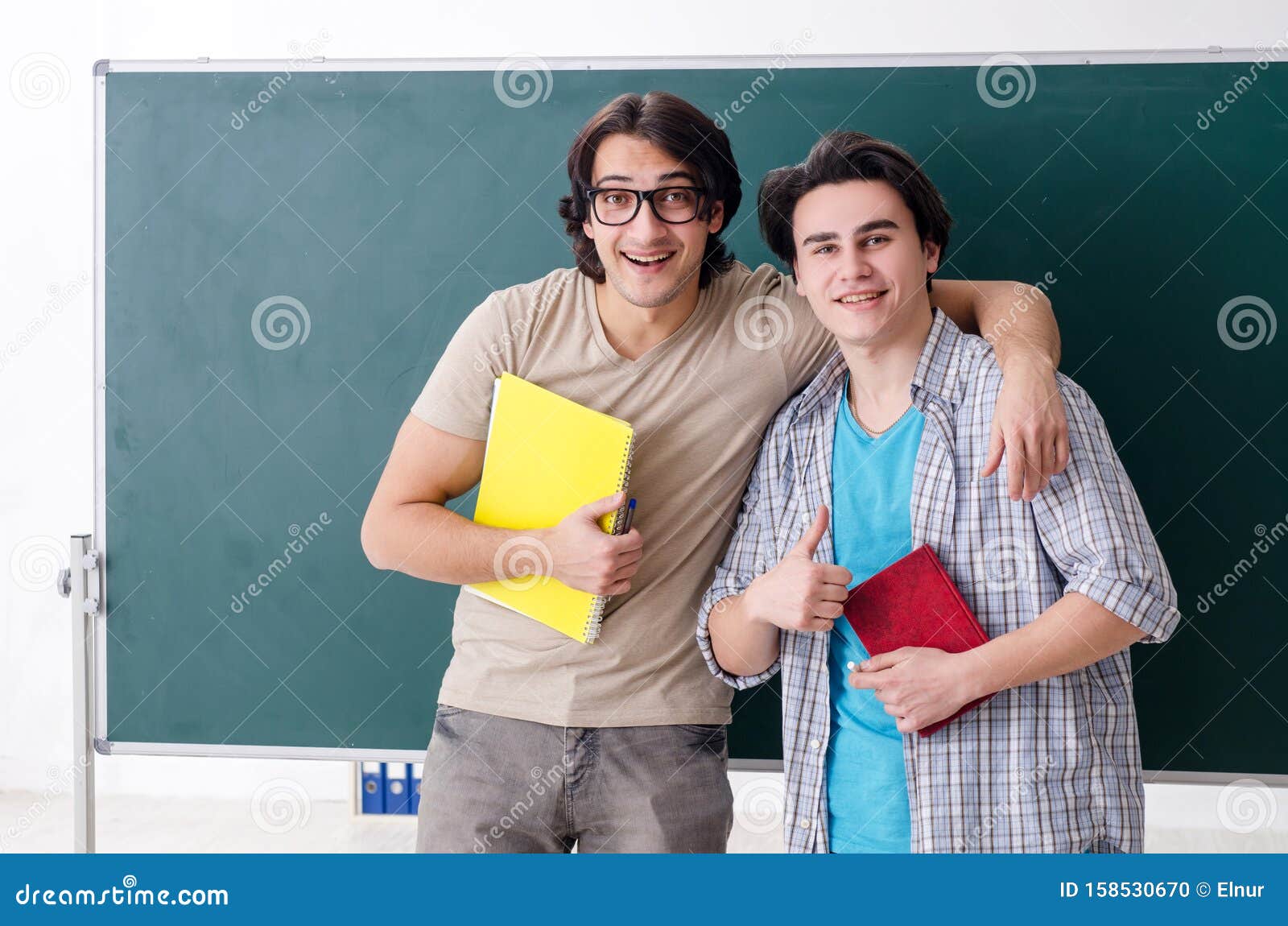 Two Male Students in the Classroom Stock Photo - Image of blackboard ...