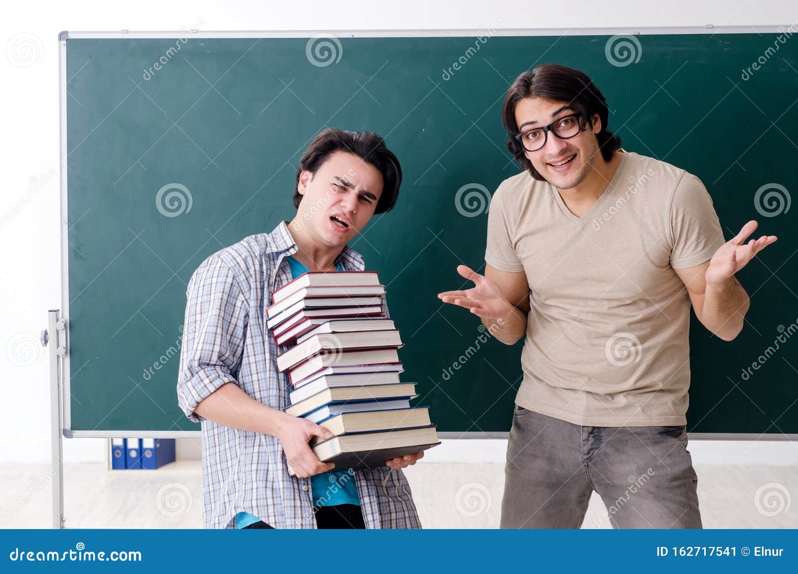 Two Male Students in the Classroom Stock Image - Image of book ...