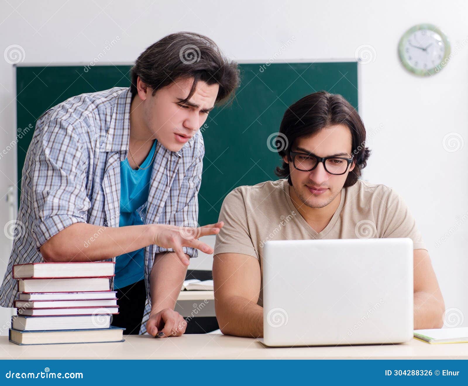 Two Male Students in the Classroom Stock Photo - Image of book ...