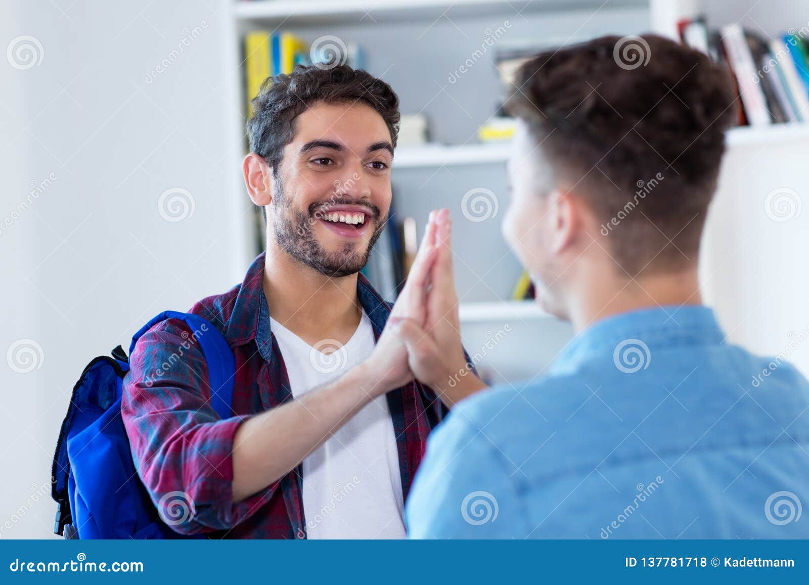 Two Male Students Giving High Five Stock Photo - Image of joking ...
