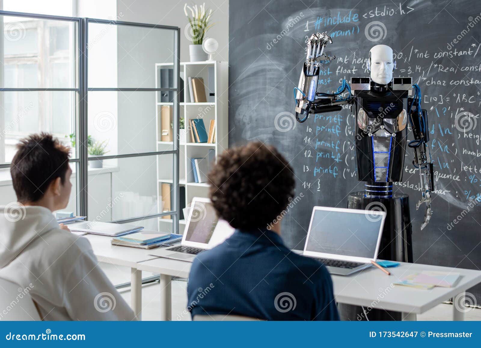 Two Male Students Looking at Automation Computer Robot Standing by ...