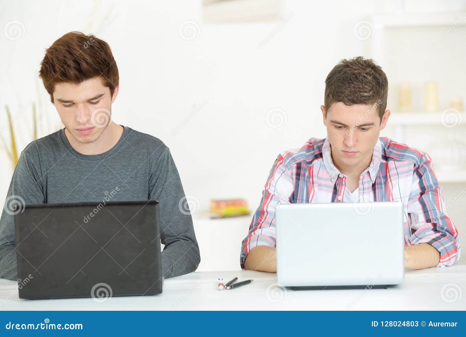 Two Male Students Using Laptops Stock Image - Image of task, academic ...