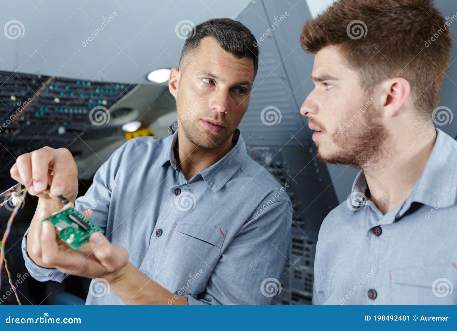 Two Male Technicians Looking at Electronic Chip Stock Image - Image of ...
