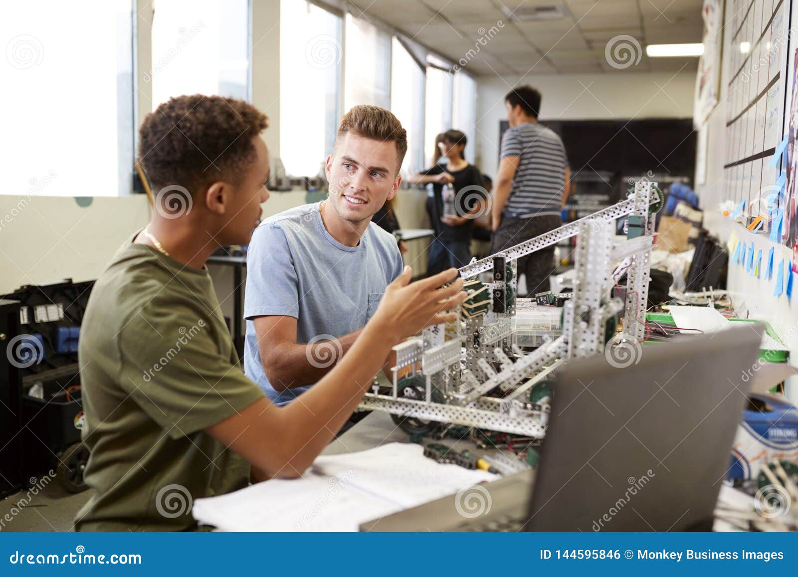 Two Male University Students Building Machine in Science Robotics or ...
