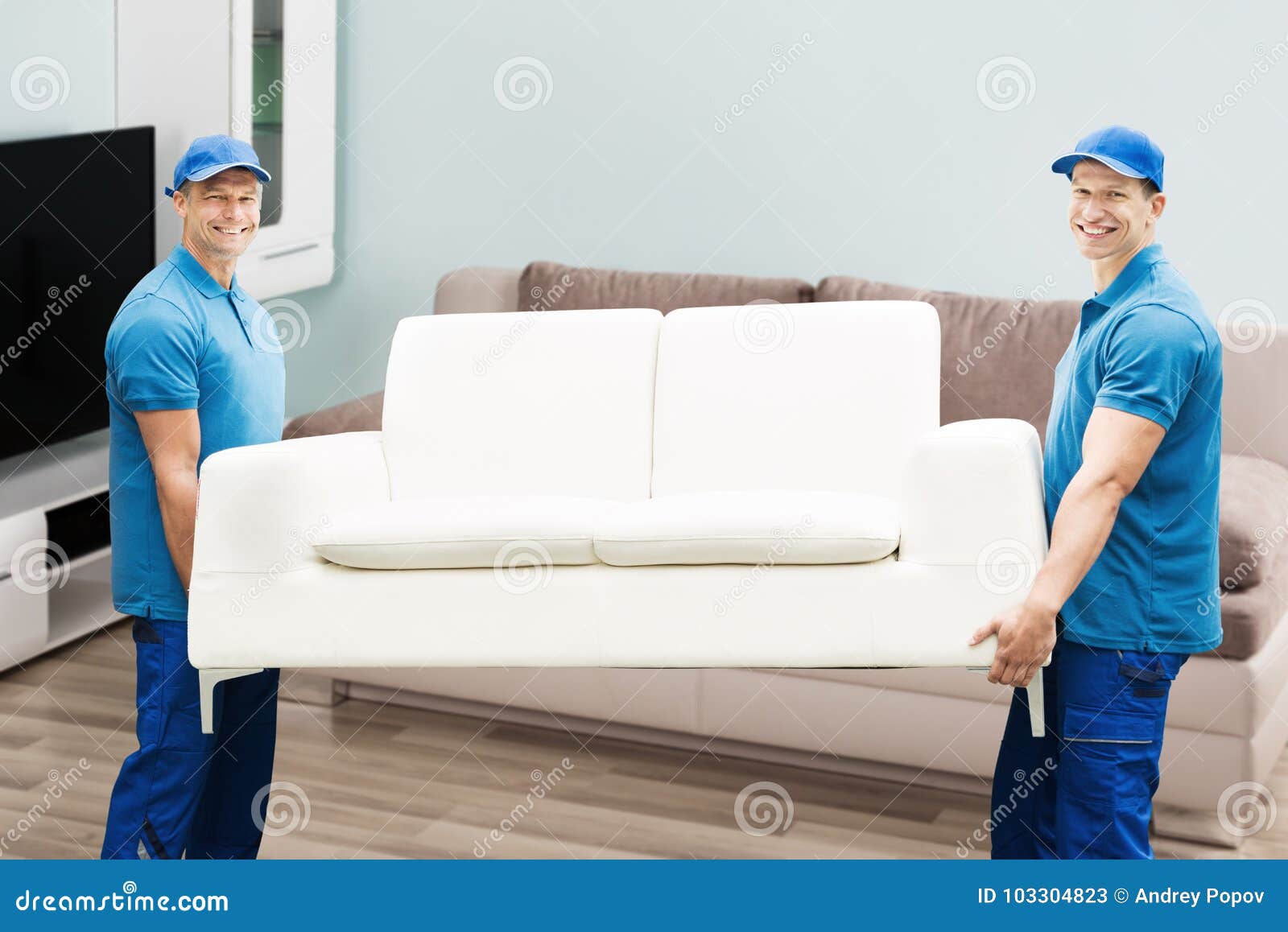 Two Male Workers Carrying Sofa Stock Image - Image of estate ...