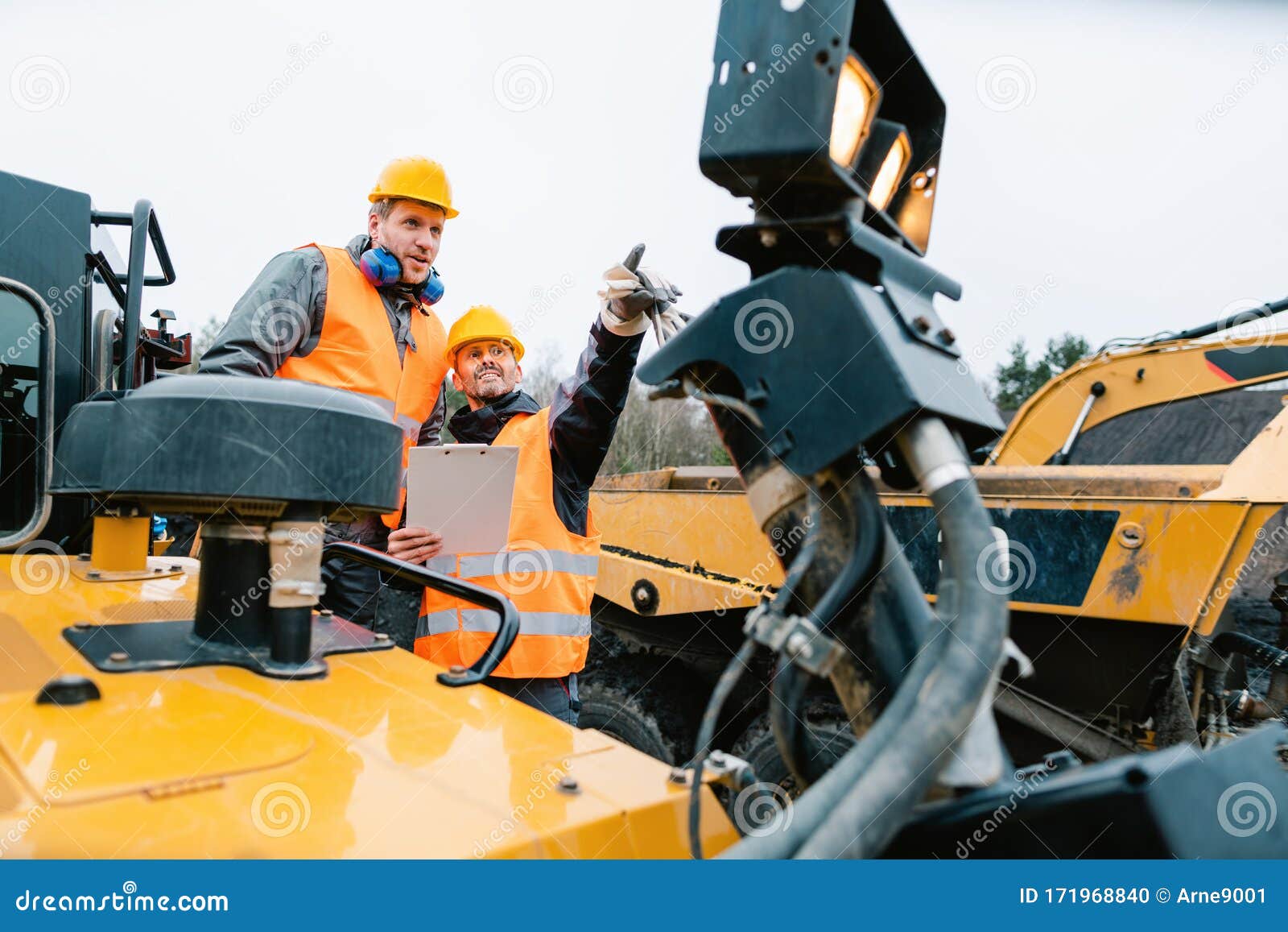 Two Male Workers on Excavator in Digging Operation or Quarry Stock ...