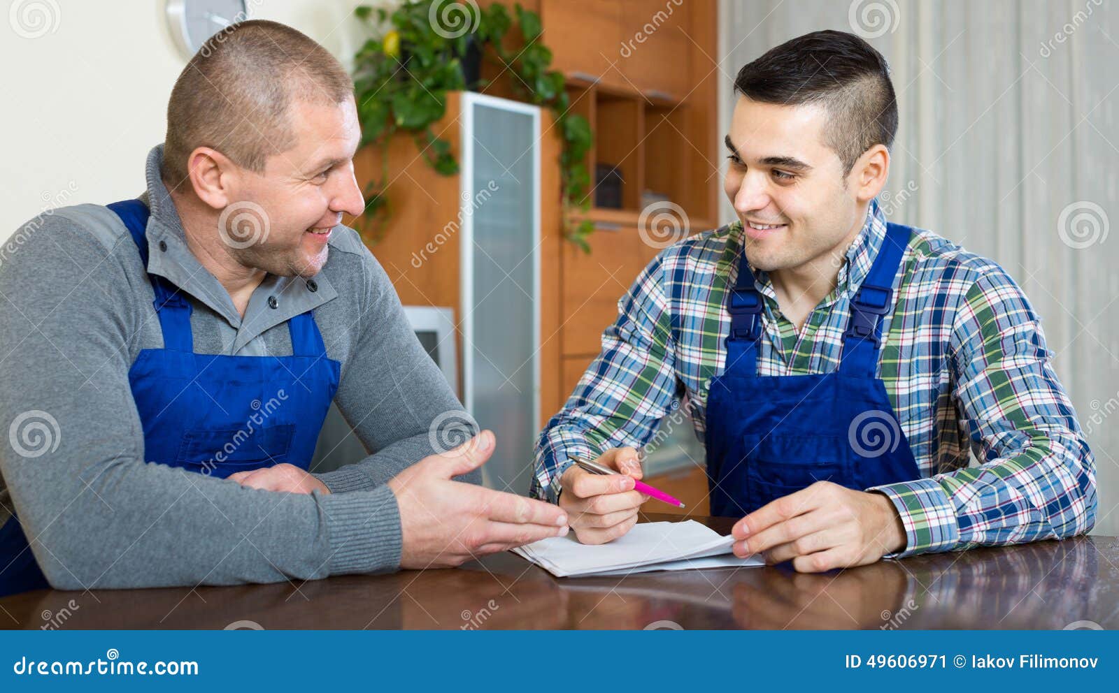 Two Male Workers Reading Documents Stock Image - Image of people ...