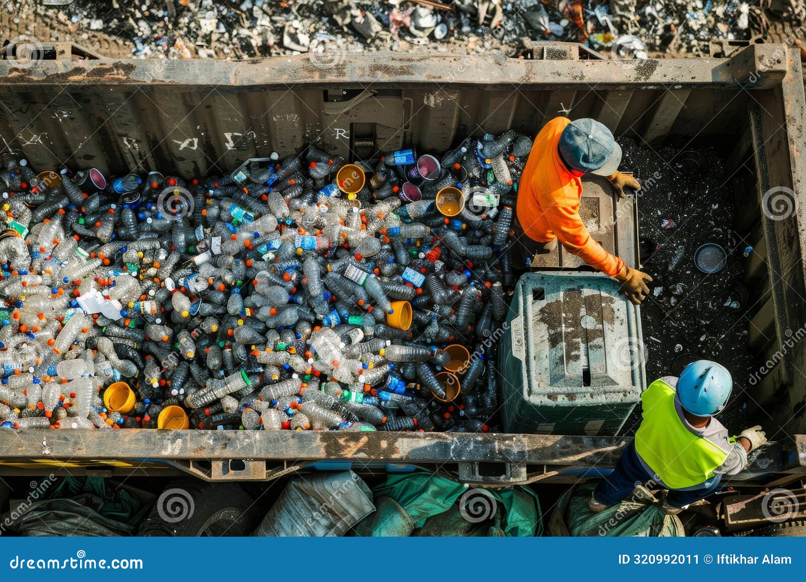 Two Male Workers are Sorting through a Dumpster Filled with Plastic ...
