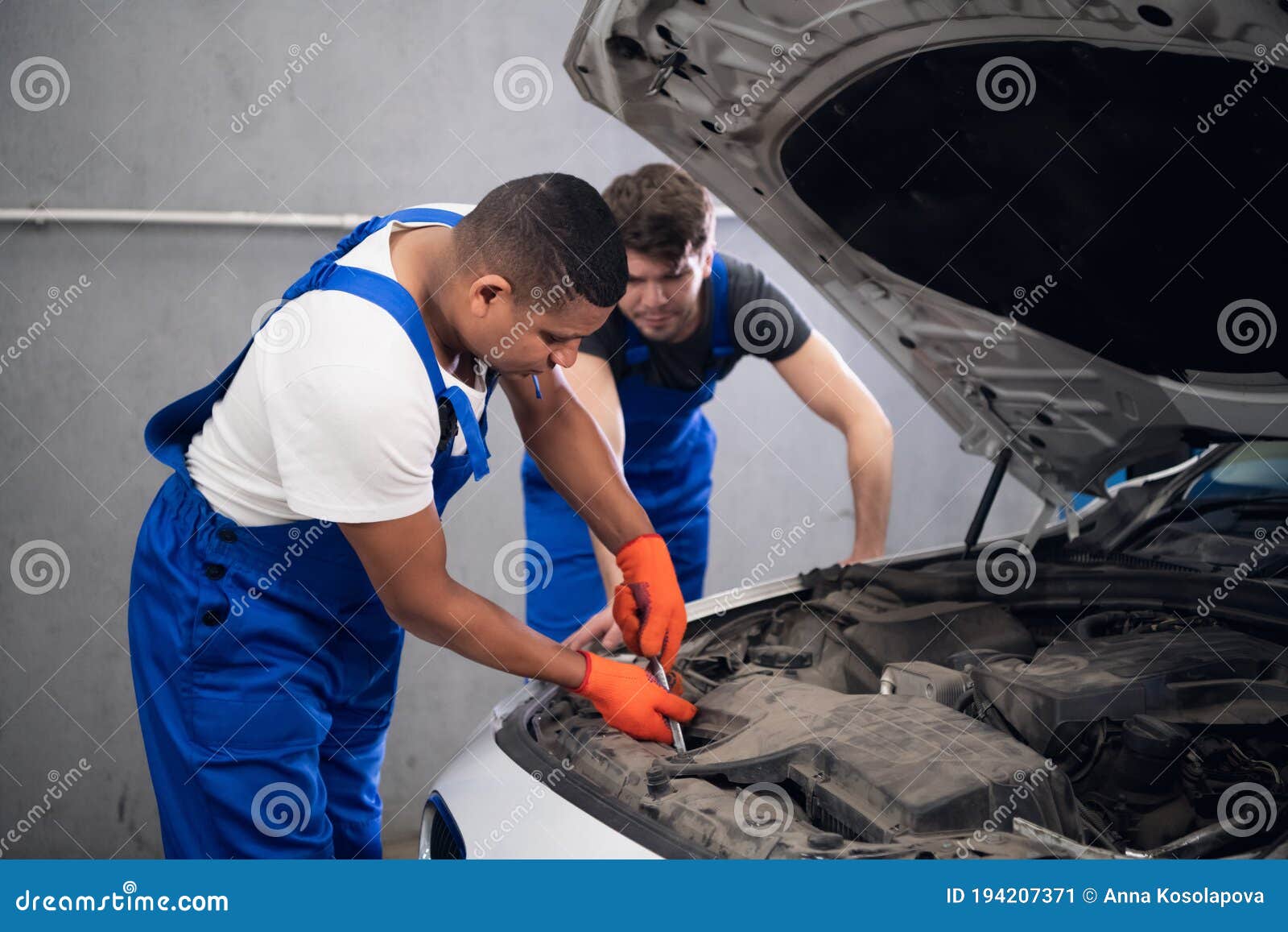Two Workmen Repair a Damaged Car Engine Stock Image - Image of ...