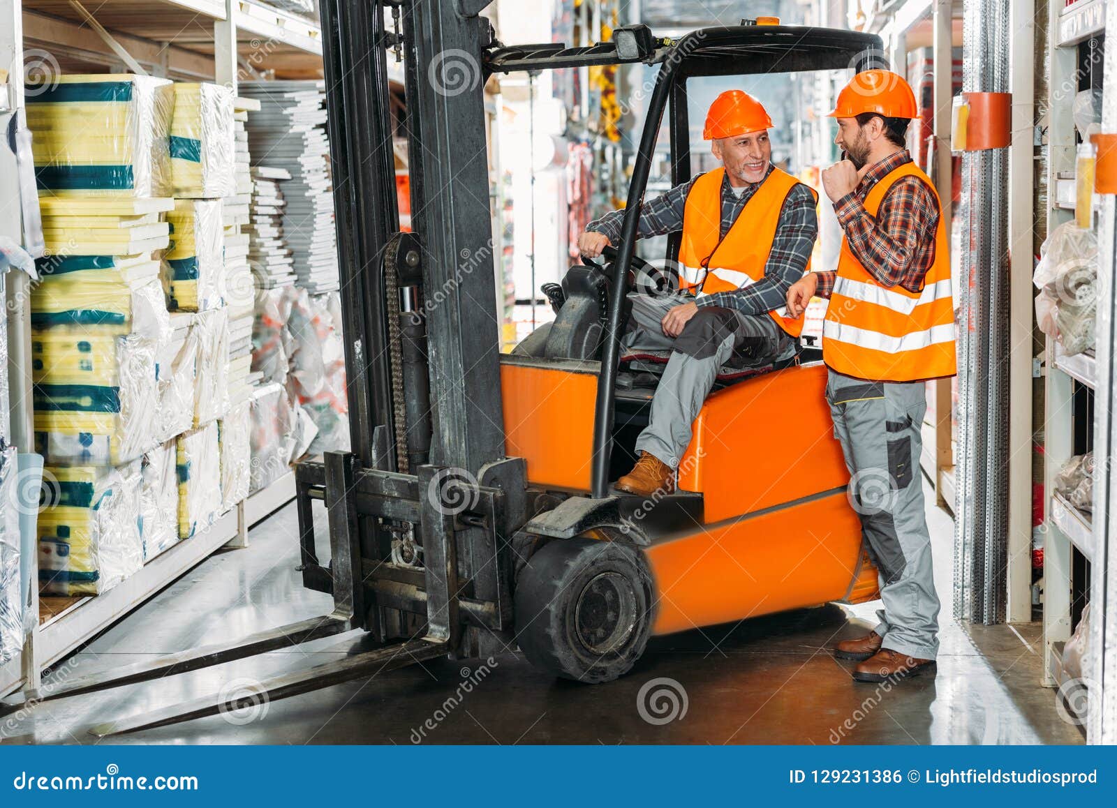 Two Male Workers Using Forklift Machine Stock Photo - Image of ...