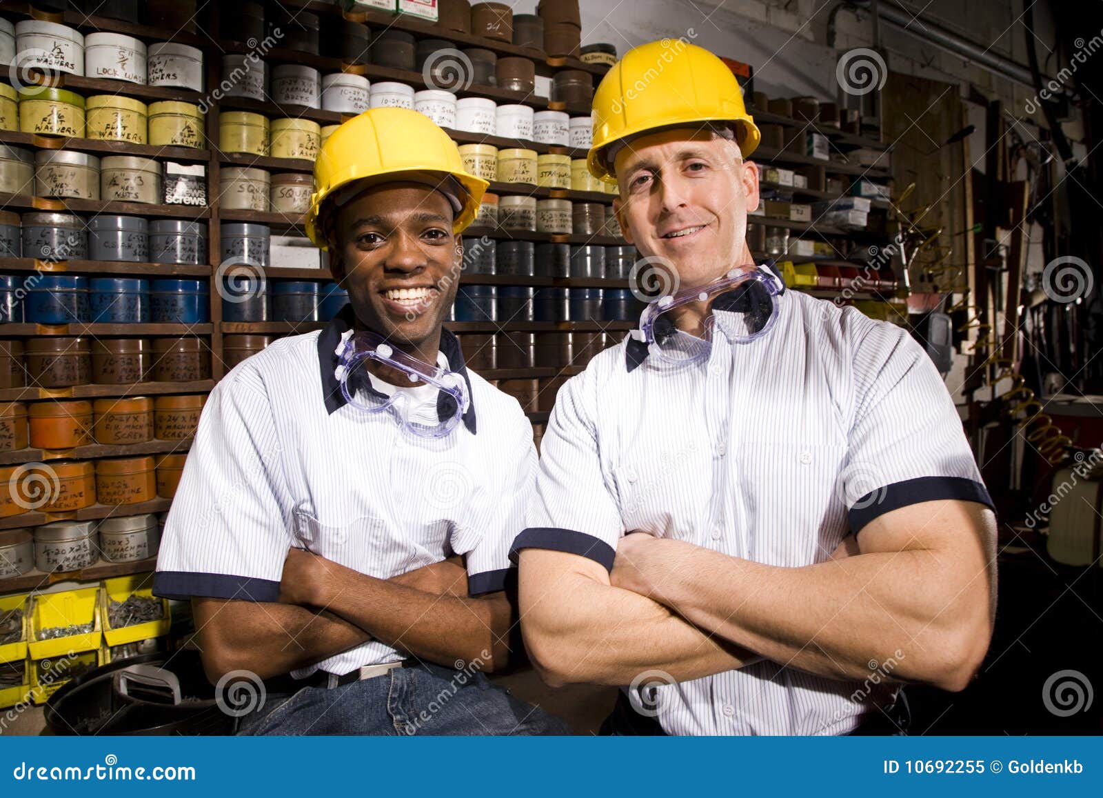 Two Male Workers Wearing Hard Hats in Storage Room Stock Image - Image ...