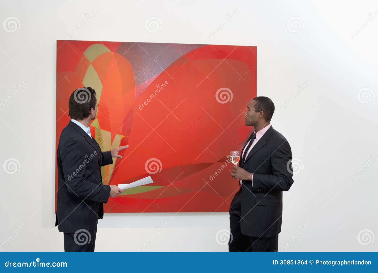 Two Males Talking Over Painting in Art Gallery Stock Photo - Image of ...