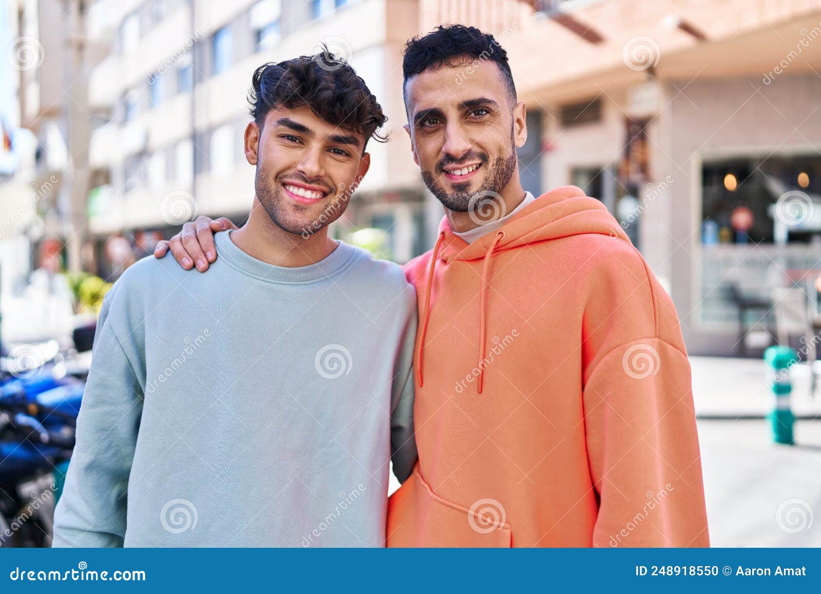 Two Man Couple Hugging Each Other Standing at Street Stock Photo ...