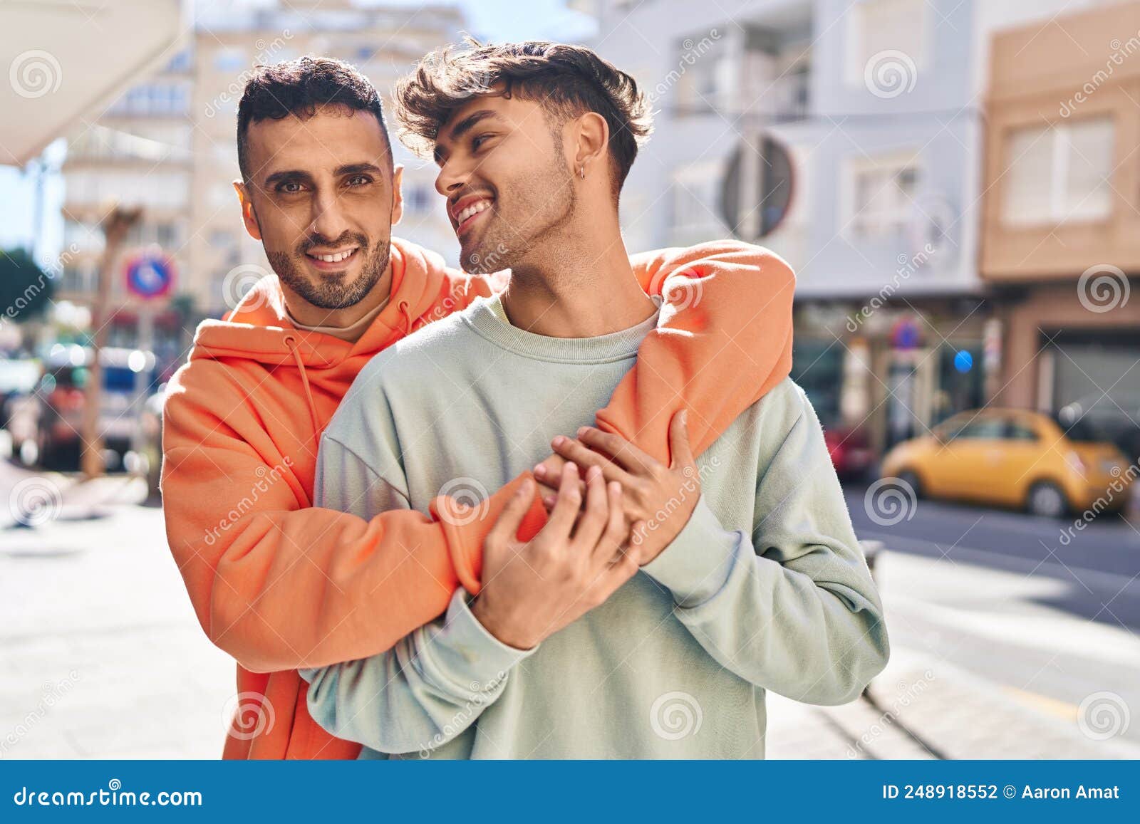Two Man Couple Hugging Each Other Standing at Street Stock Photo ...