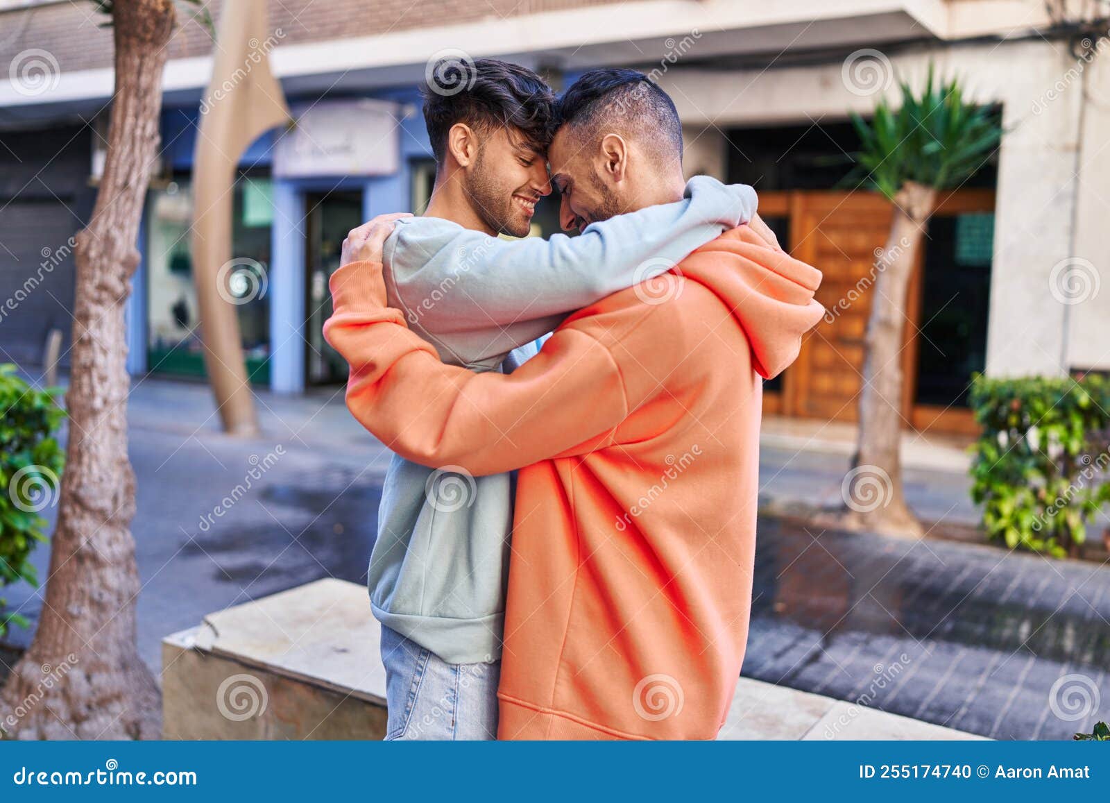 Two Man Couple Hugging Each Other Standing at Street Stock Photo ...
