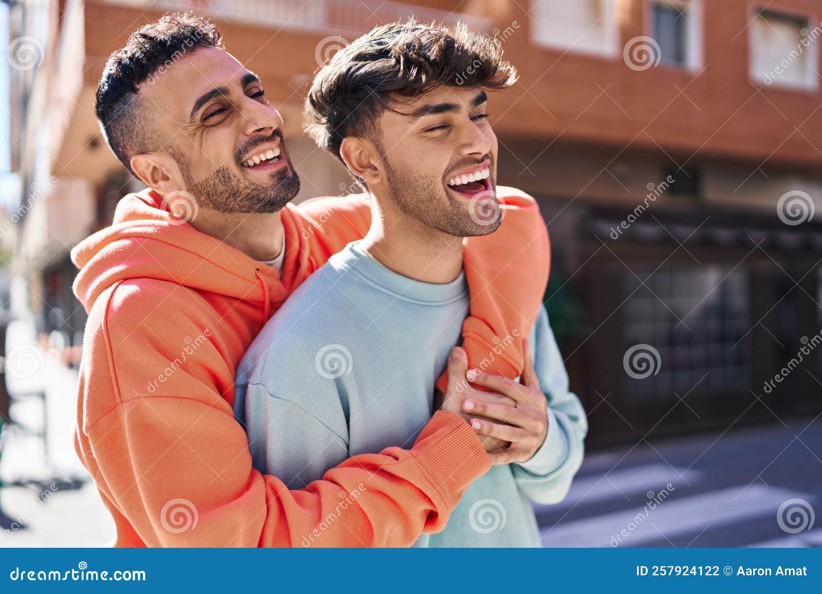 Two Man Couple Hugging Each Other Standing at Street Stock Photo ...