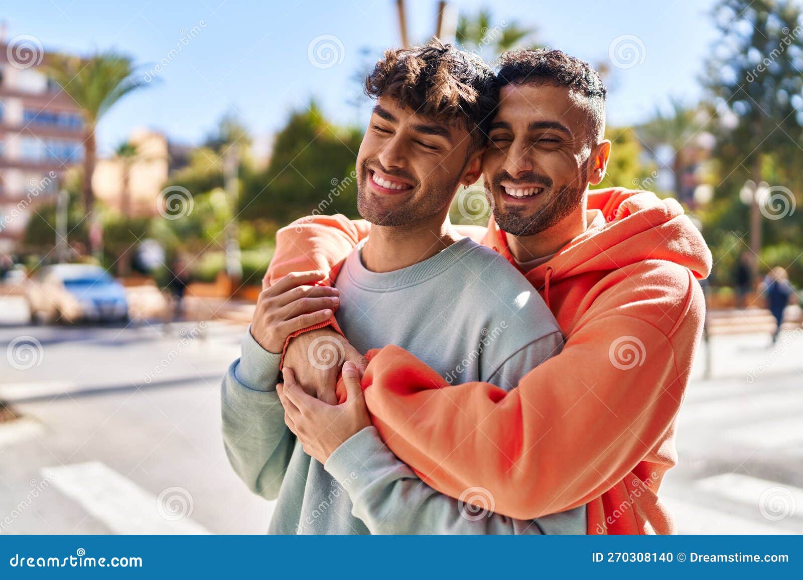 Two Man Couple Hugging Each Other Standing at Street Stock Photo ...