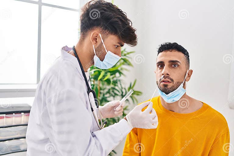 Two Man Doctor and Patient Doing Antigen Test at Clinic Stock Photo ... Two Man Doctor and Patient Doing Antigen Test at Clinic Stock Photo ...