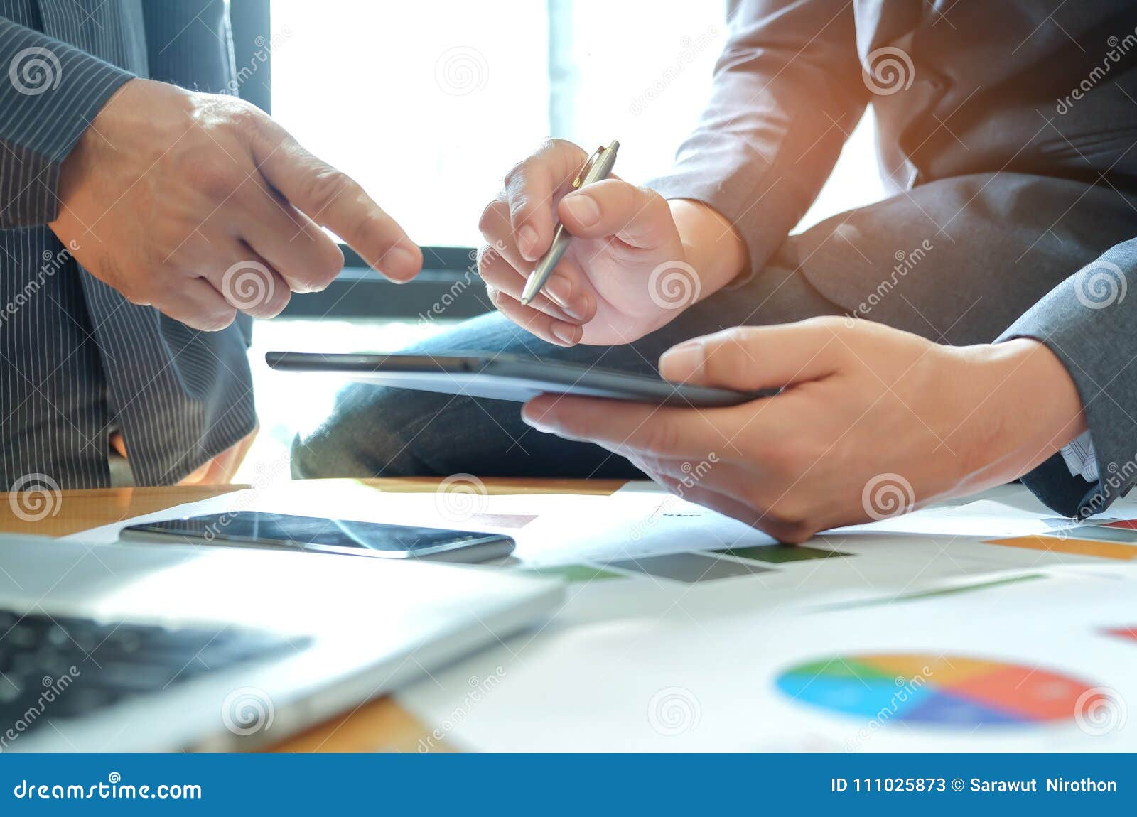 Two Man Hand are Using a Tablet,Team is Working on Data Analysis Stock ...