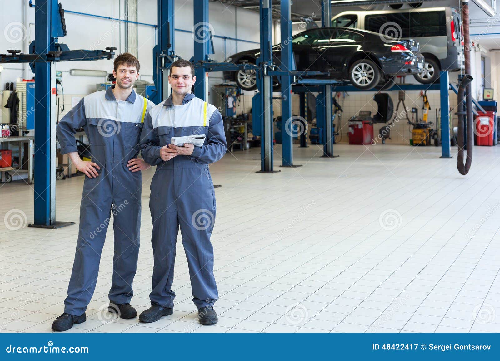 Two man mechanics working stock image. Image of combustion - 48422417