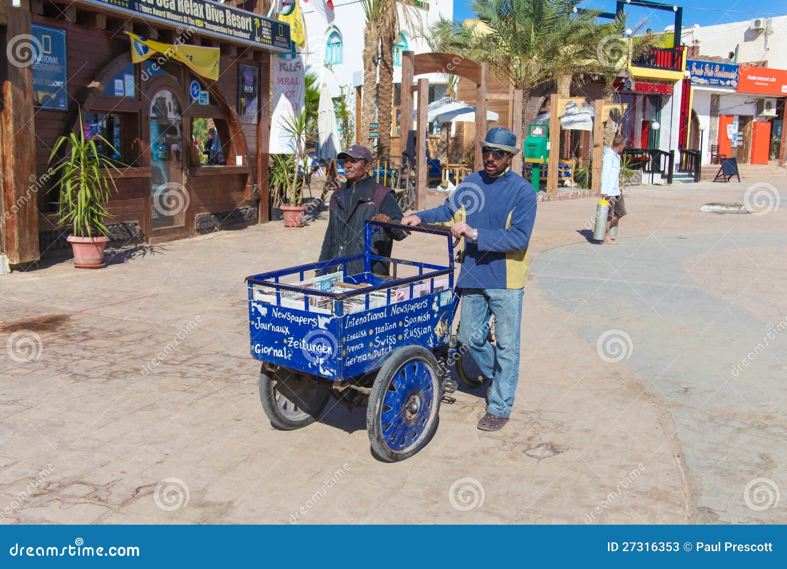 Two man pushing cart editorial stock photo. Image of mover - 27316353