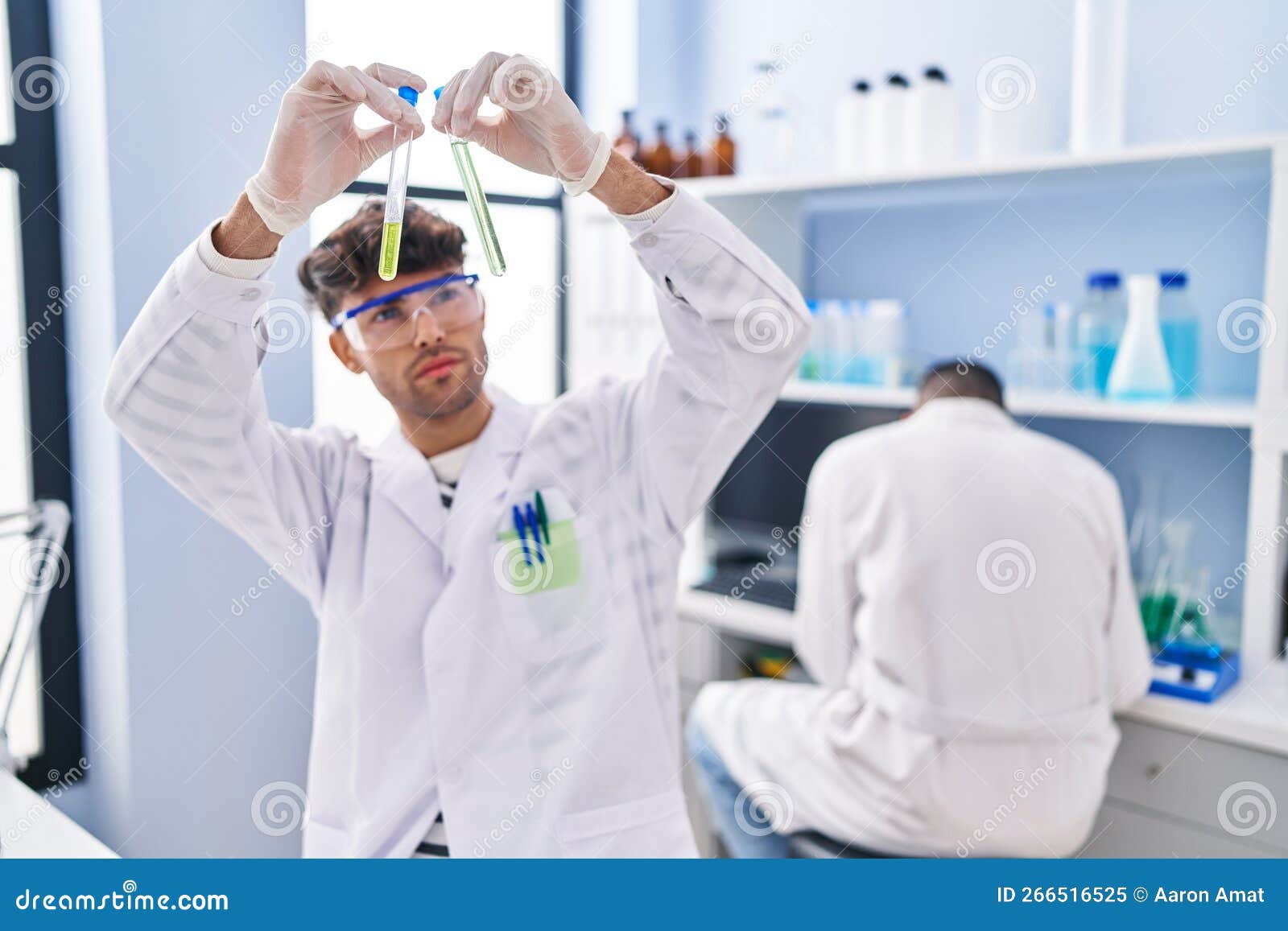 Two Man Scientists Holding Test Tubes Working at Laboratory Stock Image ...
