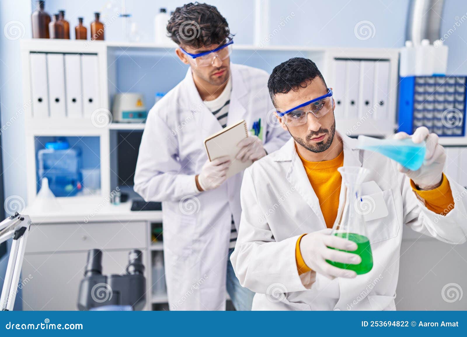 Two Man Scientists Measuring Liquid at Laboratory Stock Photo - Image ...