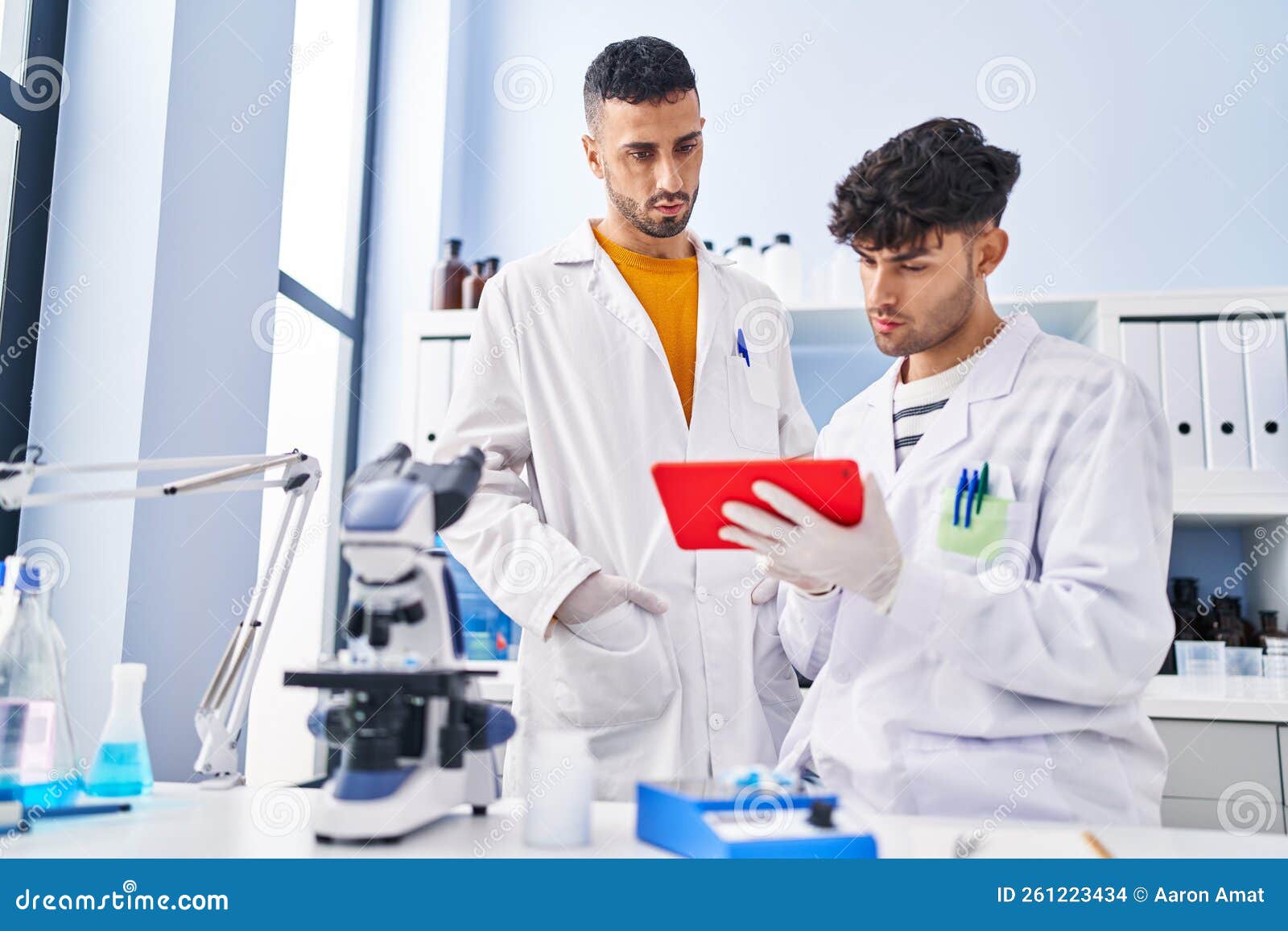 Two Man Scientists Using Touchpad Working at Laboratory Stock Photo ...