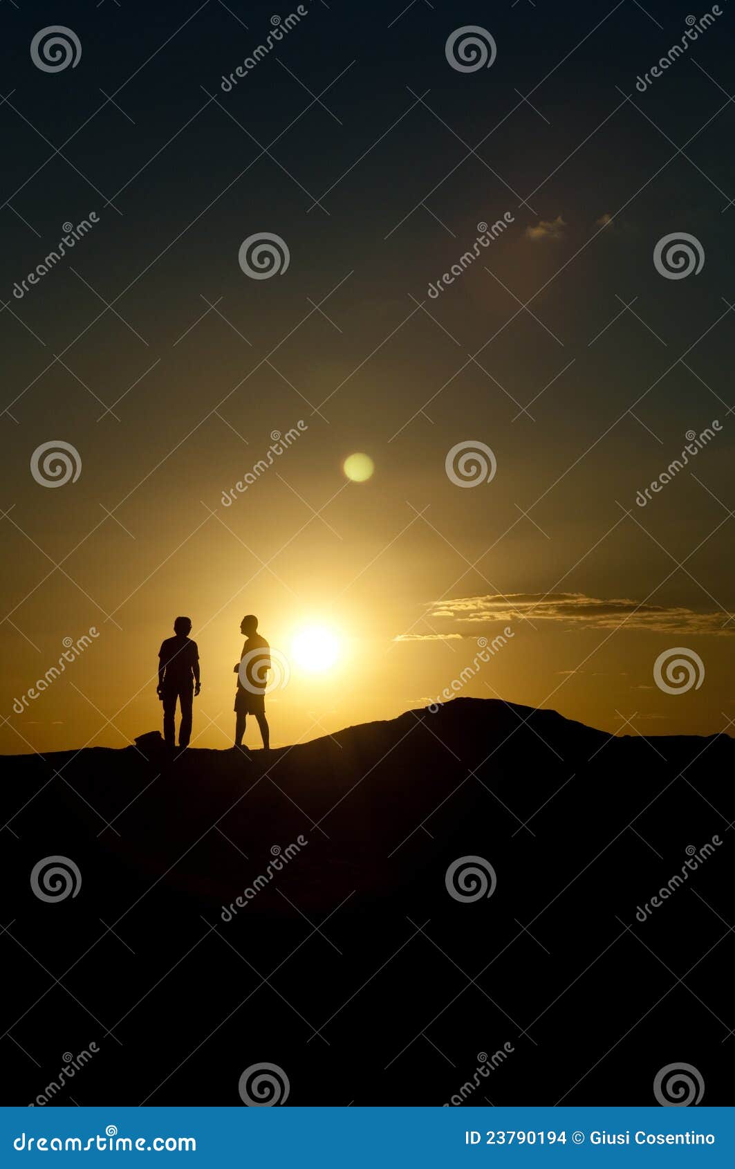 Two man at sunset stock photo. Image of sunset, conversation - 23790194