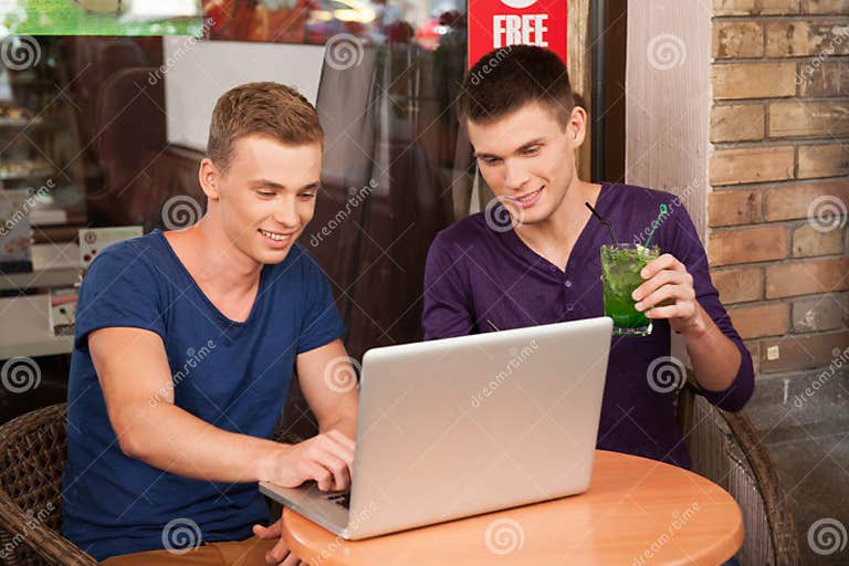 Two Man Working on Computer in Cafe. Stock Image - Image of boys ...