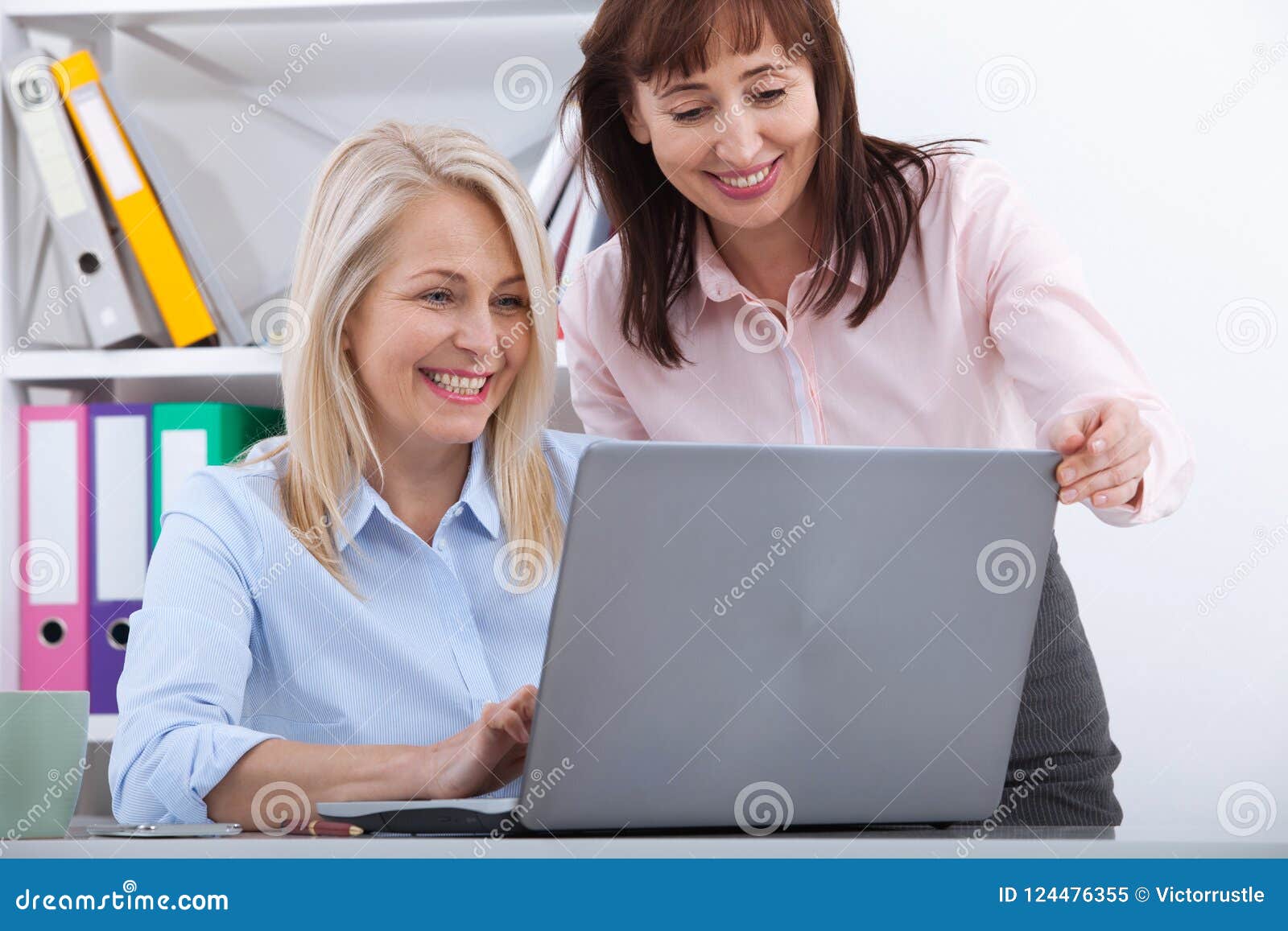 Two Managers Working on Laptop in Office. Stock Image - Image of ...